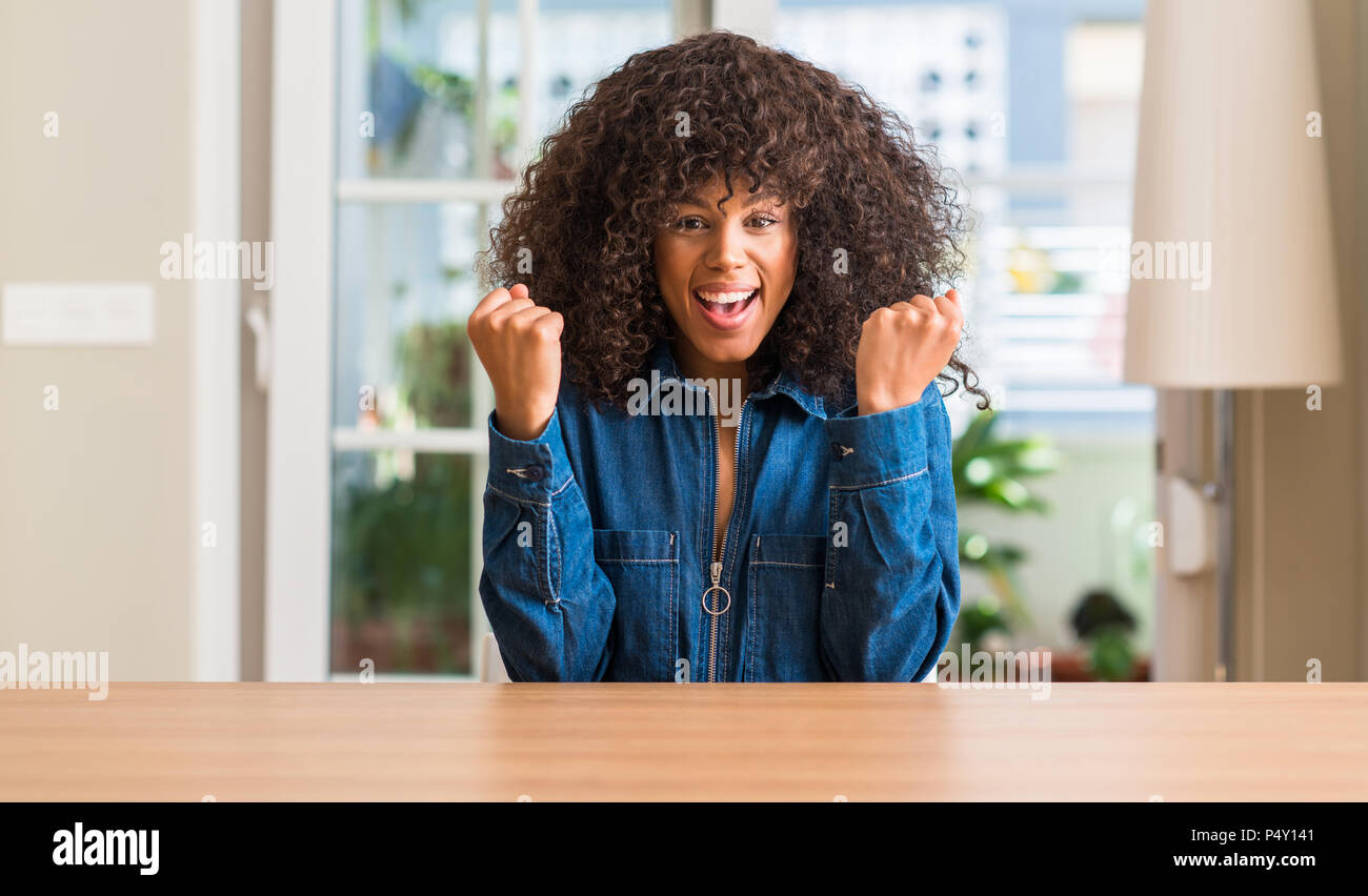 African american woman at home screaming proud and celebrating victory ...