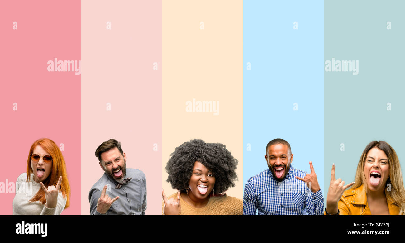 Cool group of people, woman and man making rock symbol with hands ...