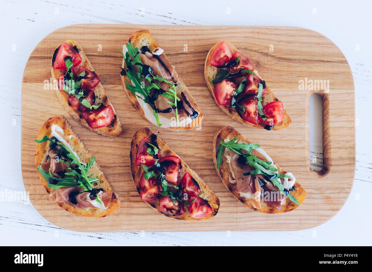 Selection of tasty Italian bruschetta or canapes on toasted baguette ...