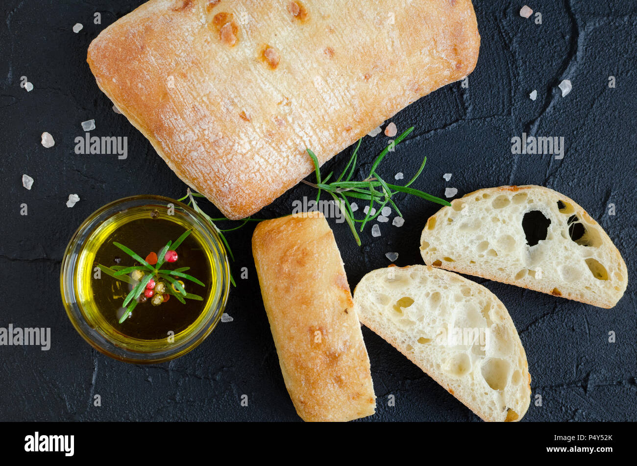 Sliced freshly baked loaf of traditional italian bread ciabatta on ...