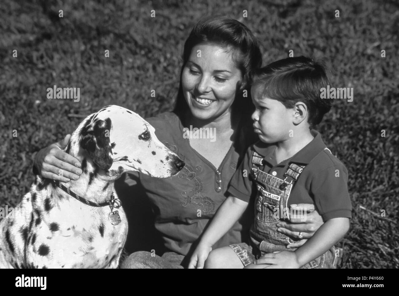 Fearful little boy meeting dog for first time. MR © Myrleen Pearson ...