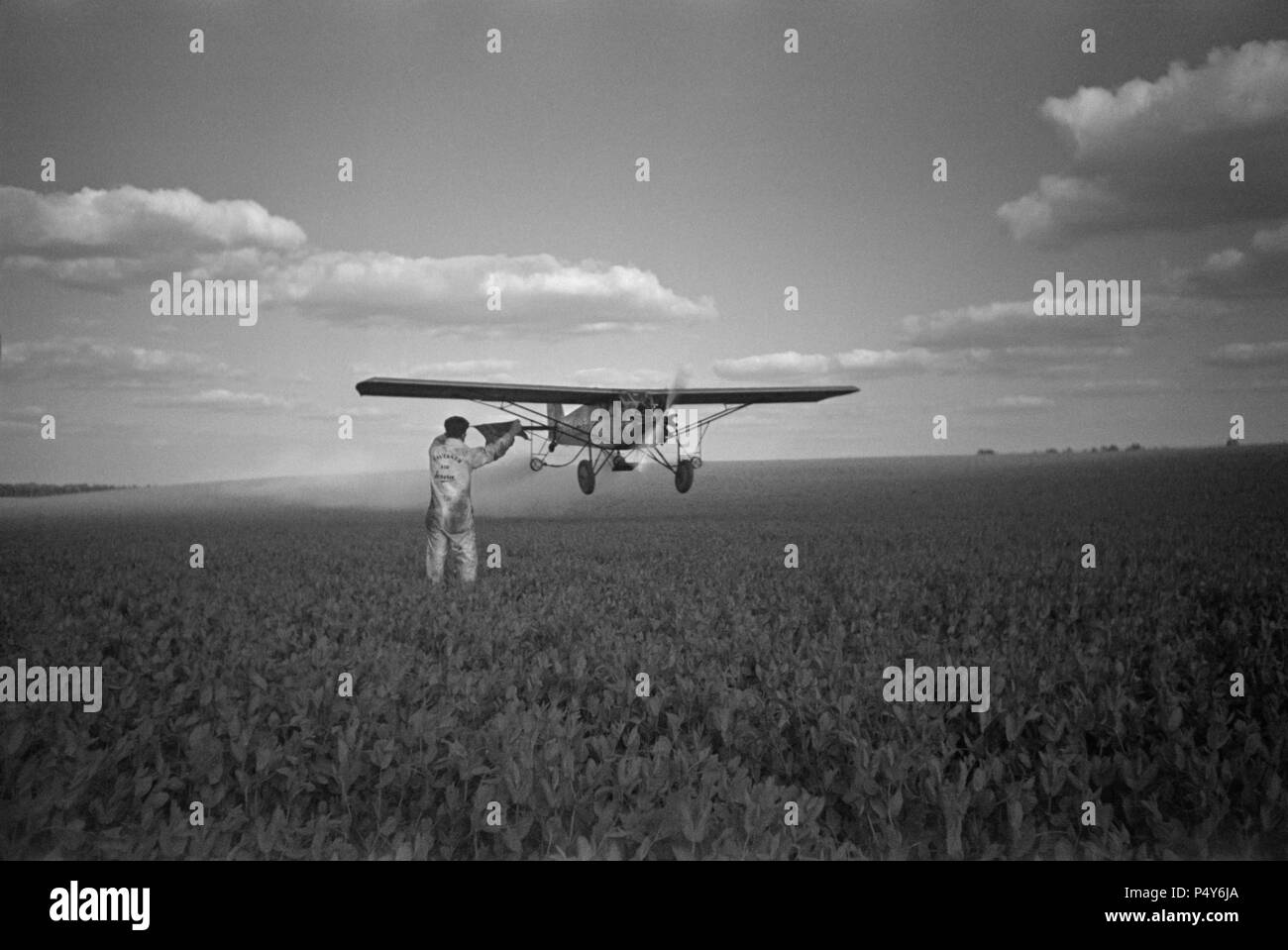 Agriculture white crop duster flying Black and White Stock Photos ...