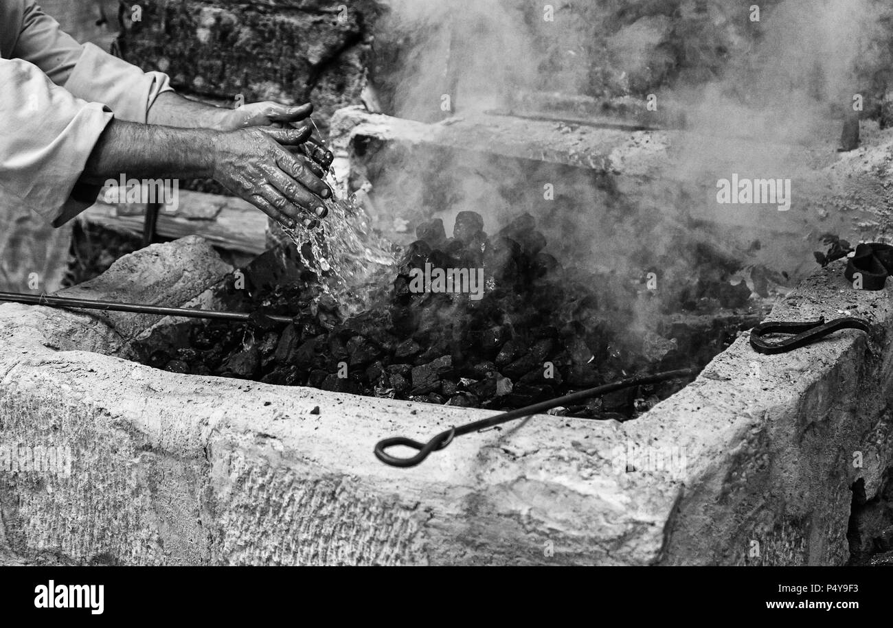 Extinguishing flames with water in the carbon, safety detail Stock ...