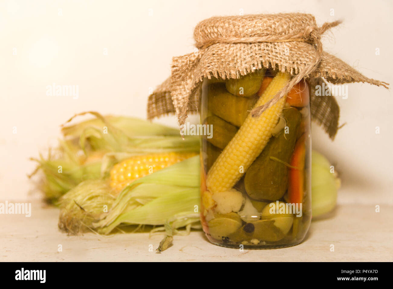 pickled corn and other vegetables in a jar Stock Photo - Alamy