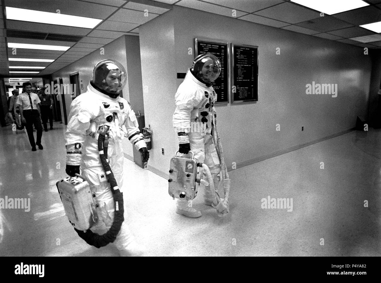 Apollo 10 astronauts John W. Young (left), command module pilot; and ...