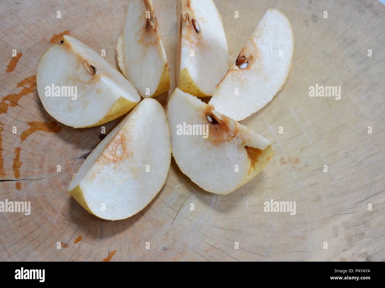 apple cutting on wooden chop block Stock Photo - Alamy