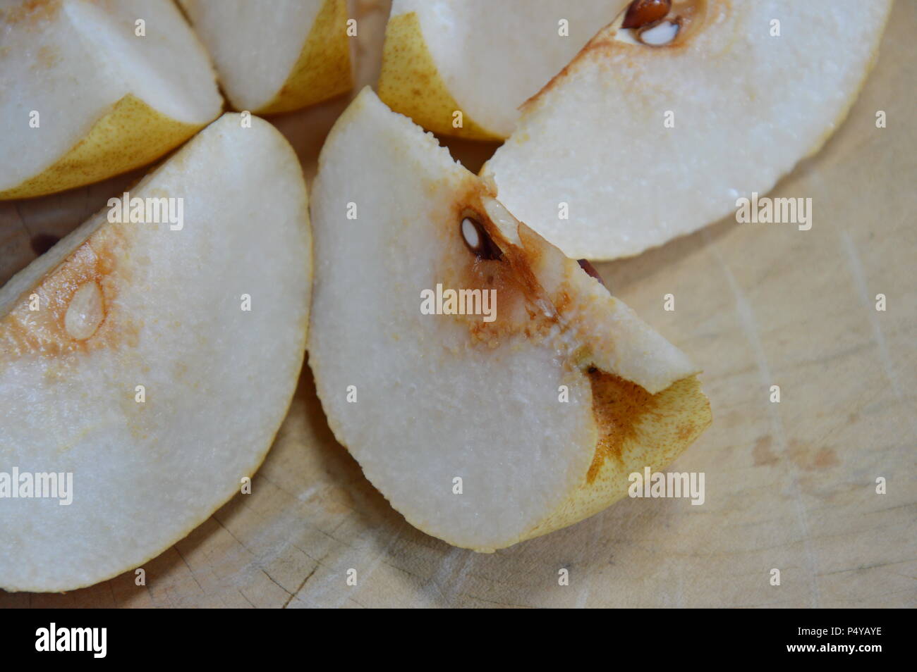 apple cutting on wooden chop block Stock Photo - Alamy