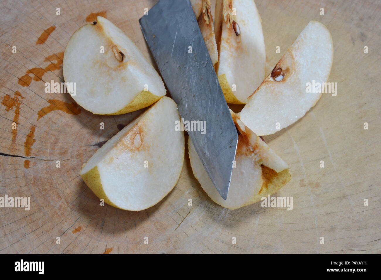 knife cut apple on wooden chop block Stock Photo - Alamy