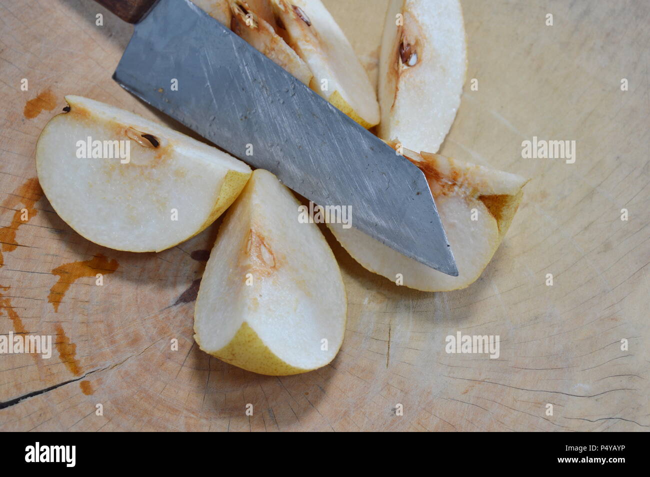 knife cut apple on wooden chop block Stock Photo - Alamy