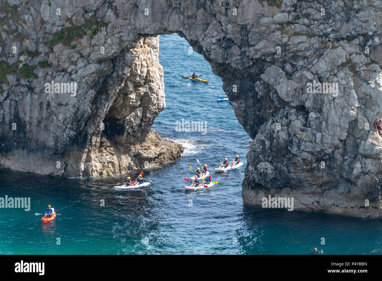 Lulworth, Dorset, UK. 23rd June 2018. People kayaking through Durdle ...