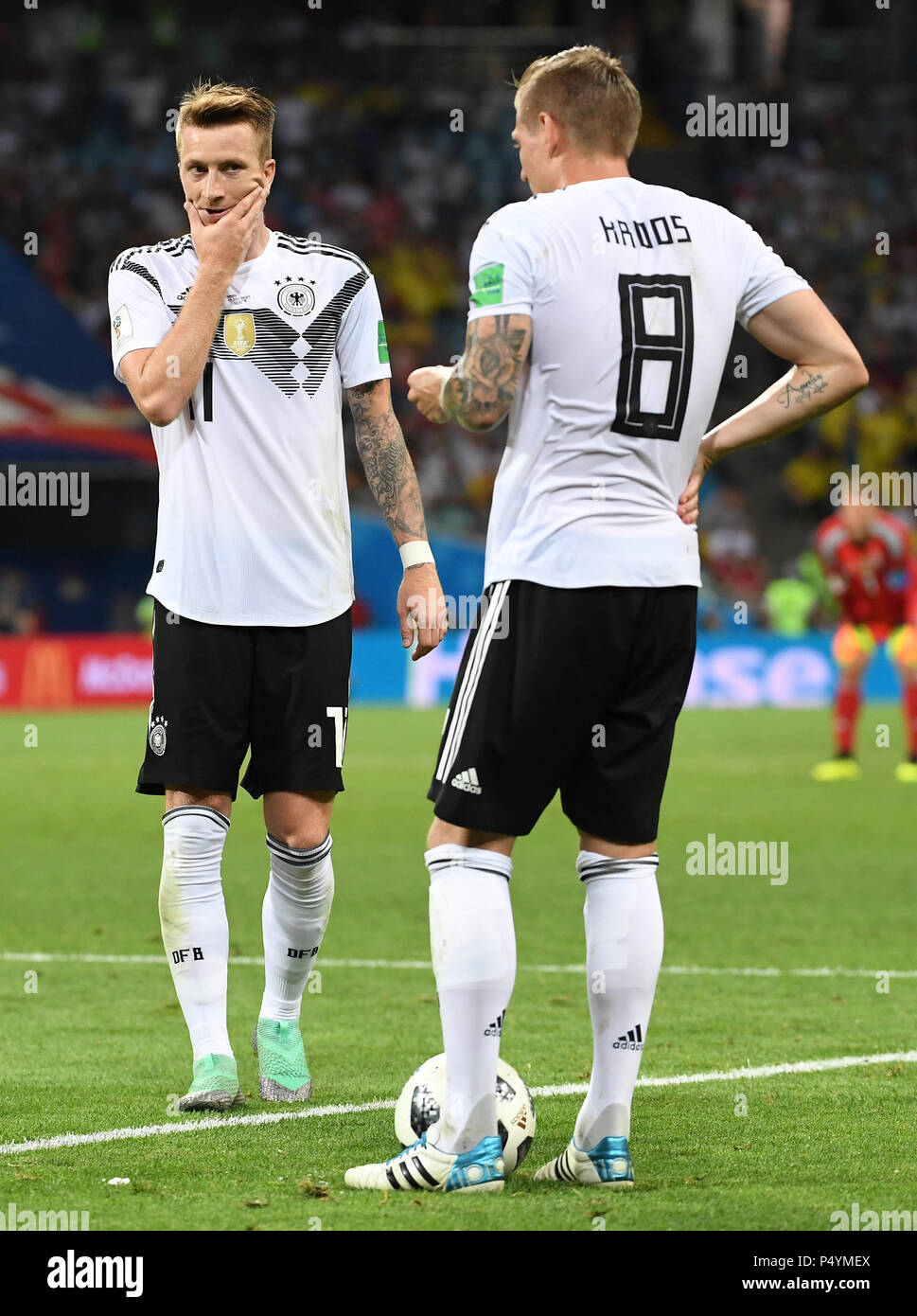 Marco Reus (Germany) speaks with Toni Kroos (Germany)/r. shortly before ...