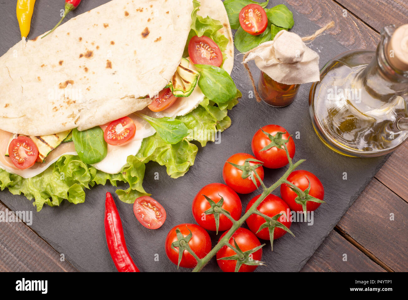 Italian piadina romagnola flatbread with lettuce, cherry tomatoes ...