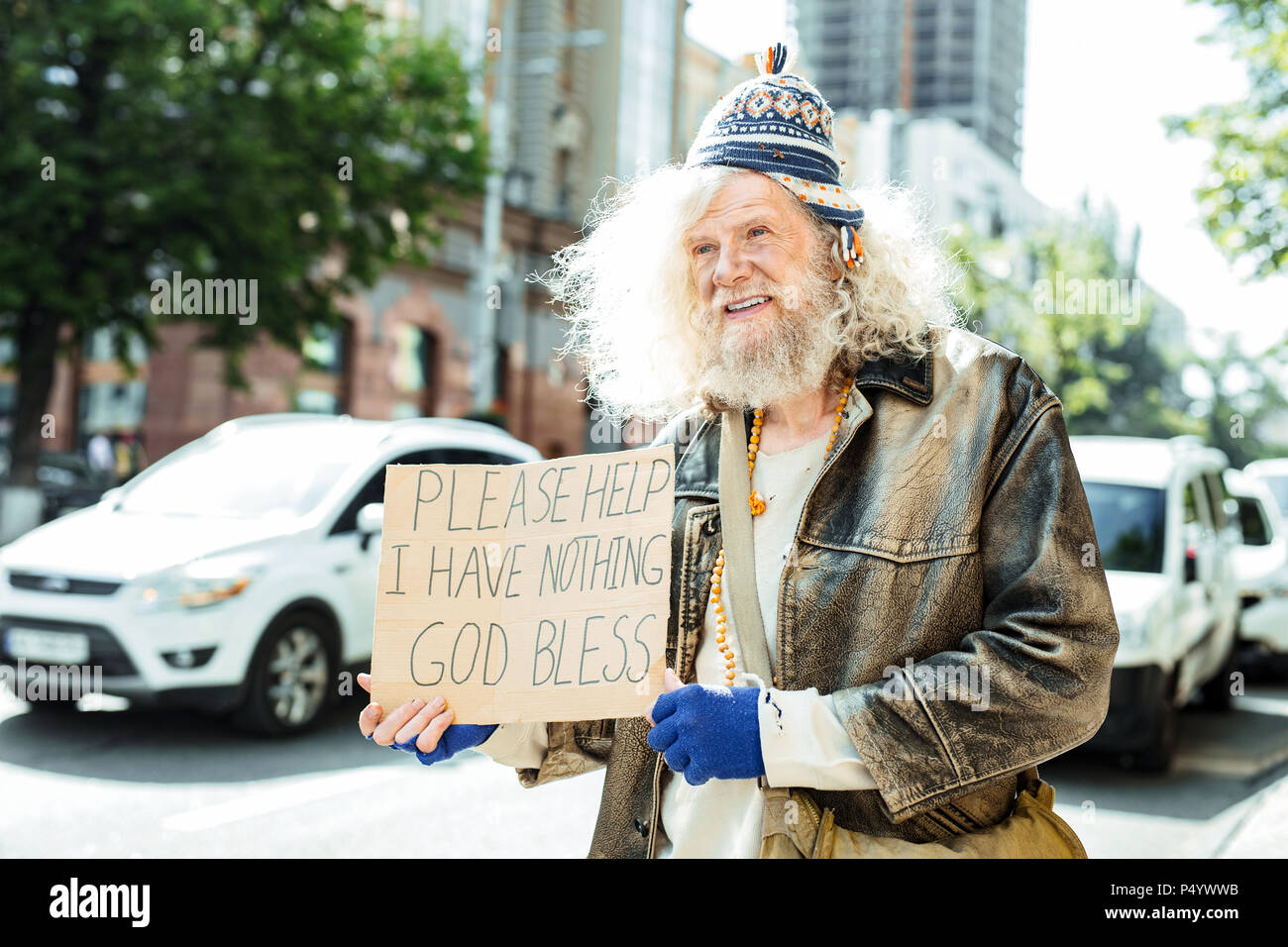Starving fugitive asking for help standing in the street Stock Photo ...