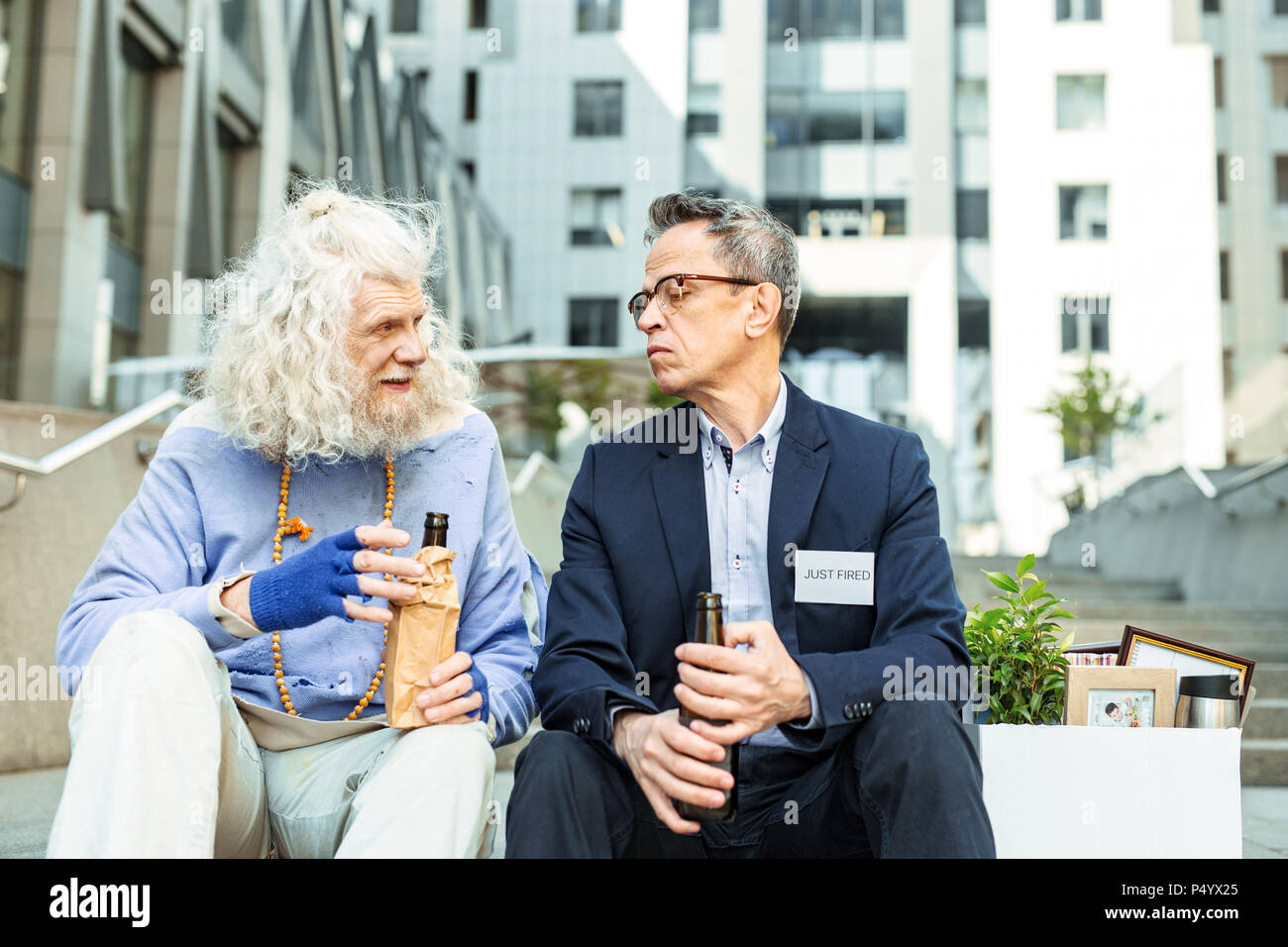 Strange hippy street man joining just fired office worker Stock Photo ...