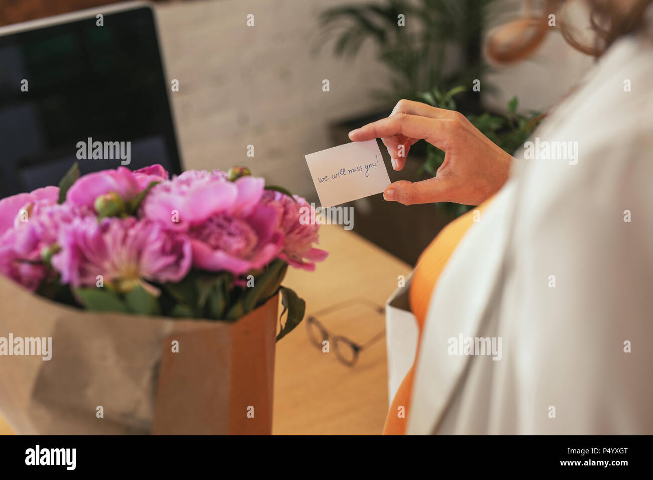Tender female hands holding present card Stock Photo - Alamy