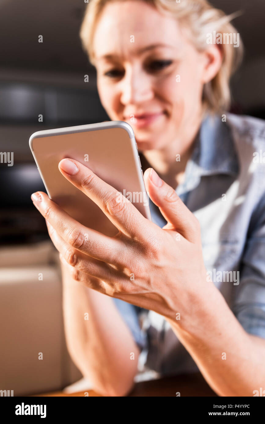 Hands holding smartphones typing hi-res stock photography and images ...