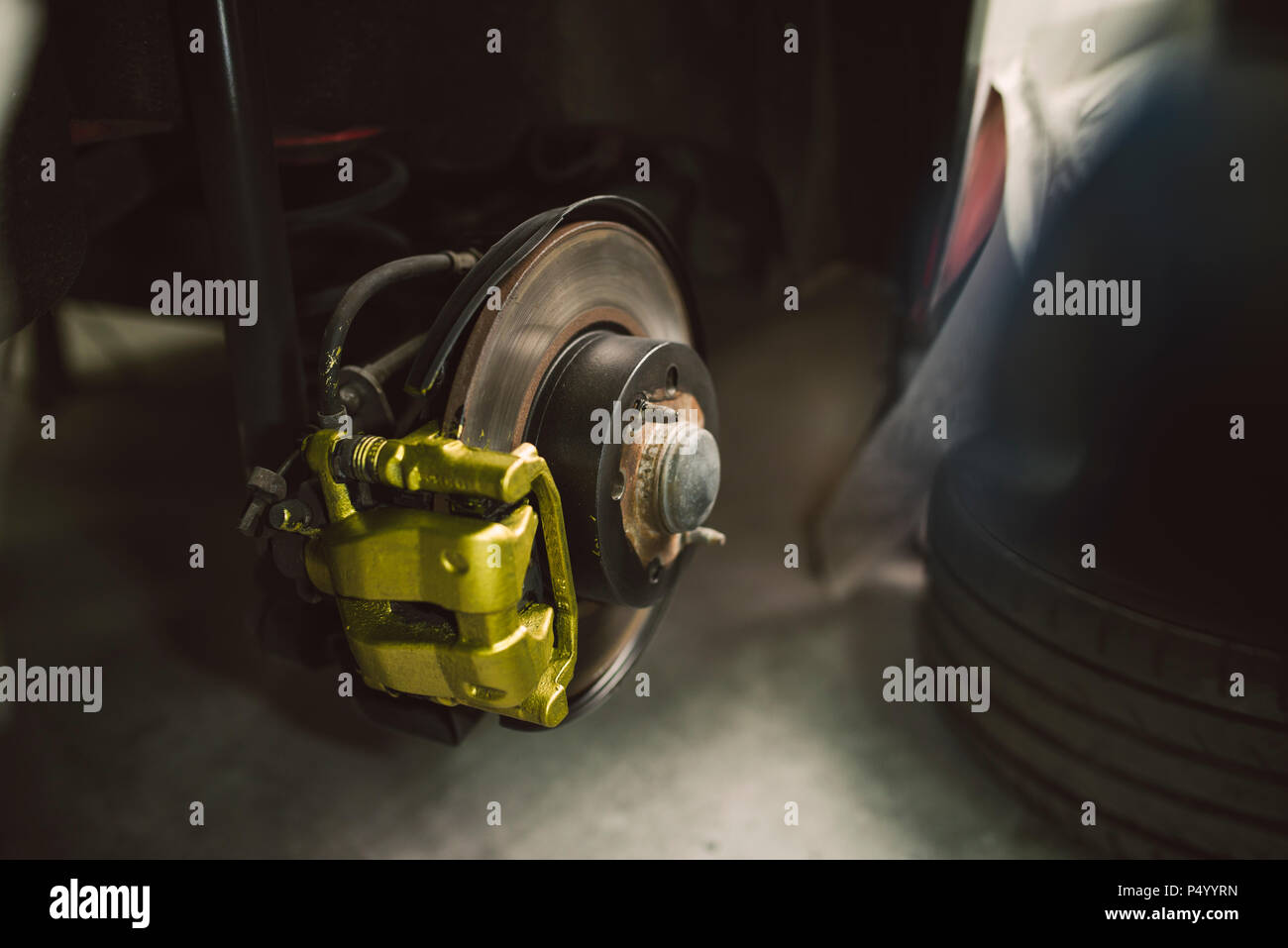 Detail of a disc and brake caliper of a car Stock Photo - Alamy