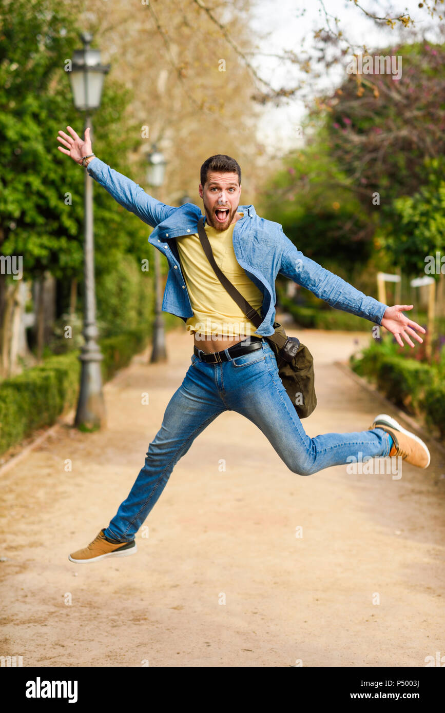 Young man jumping Stock Photo - Alamy