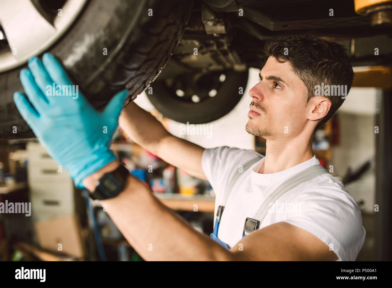 Mechanic working in car hi-res stock photography and images - Alamy