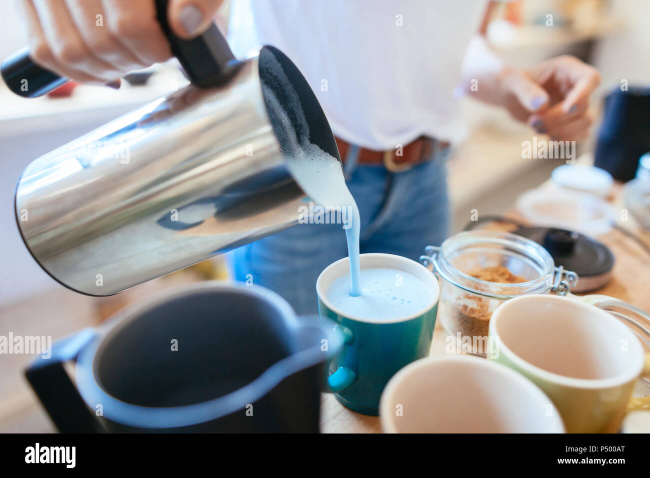 Close up female hands pouring hi-res stock photography and images - Alamy