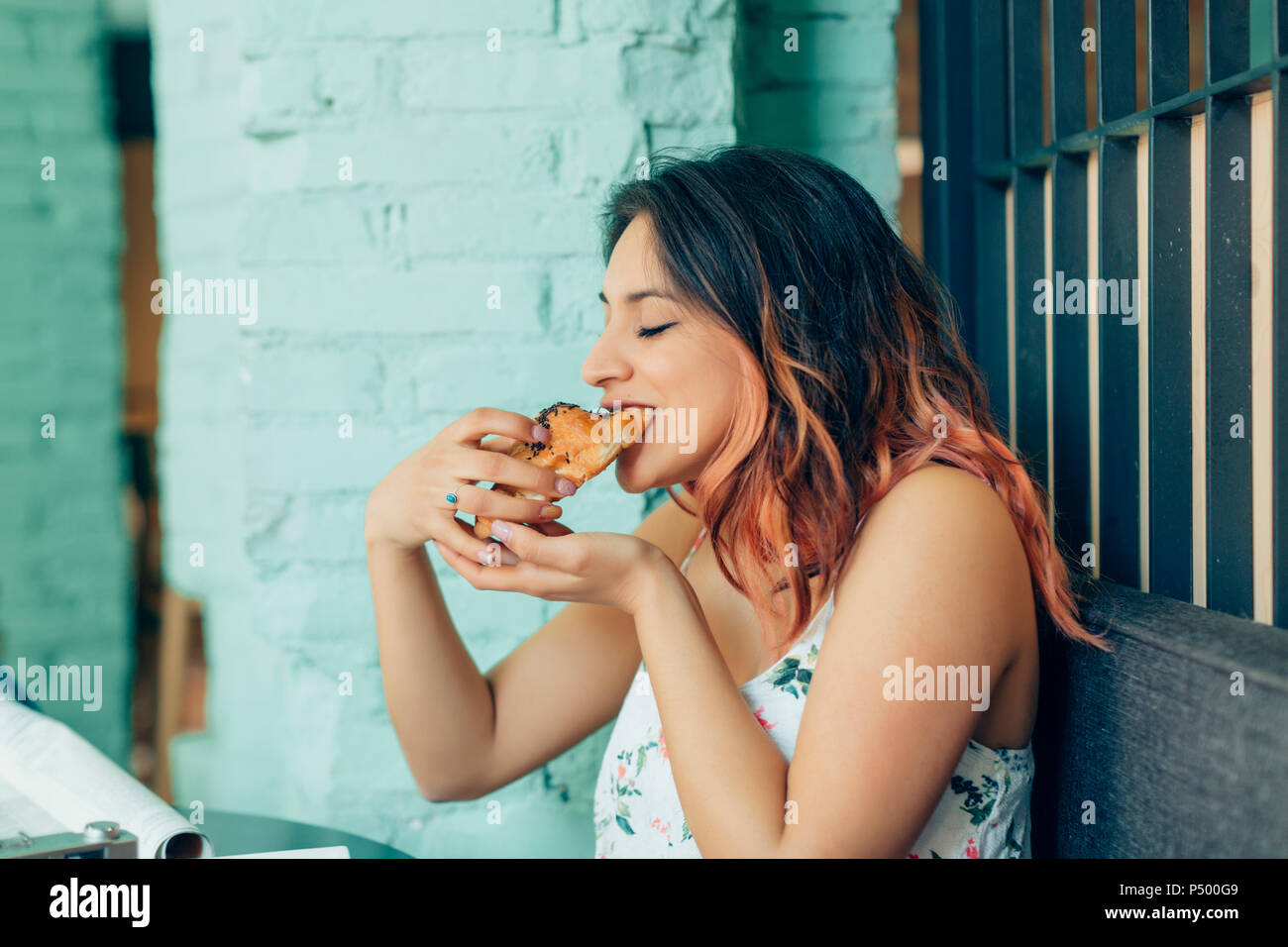Woman relaxing in coffee shop hi-res stock photography and images - Alamy