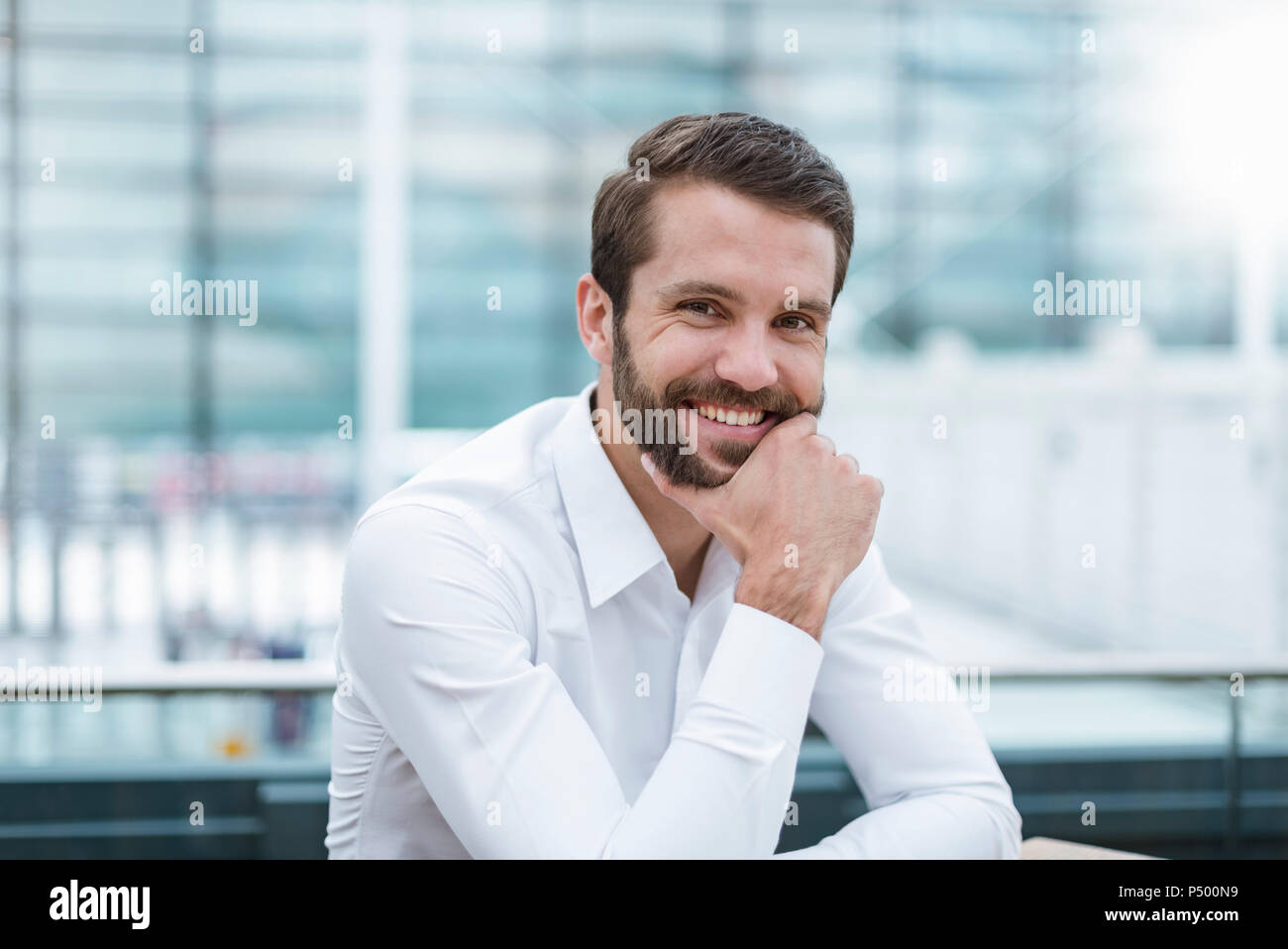 Portrait of smiling young businessman Stock Photo - Alamy