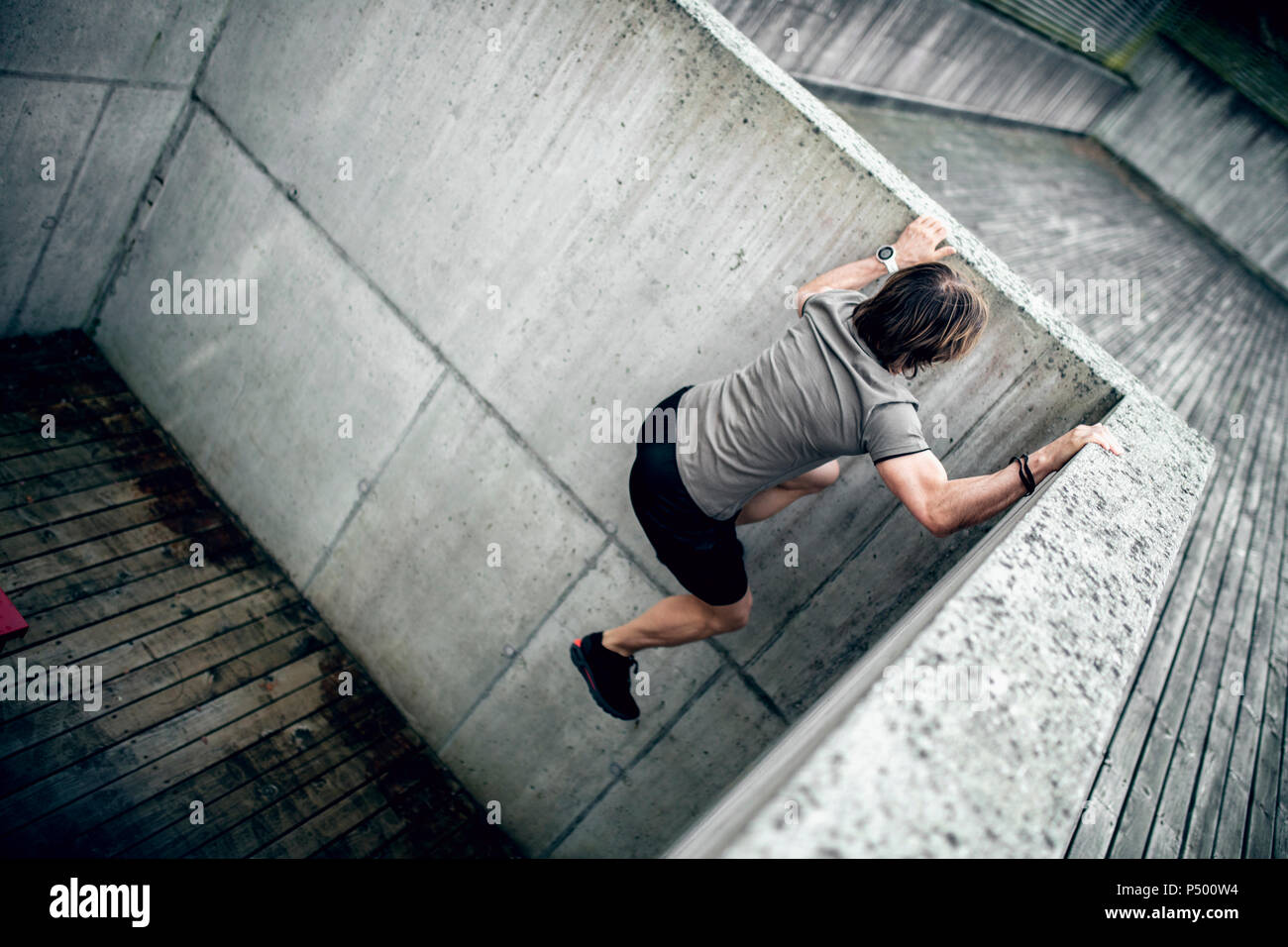 Athlete climbing wall hi-res stock photography and images - Alamy