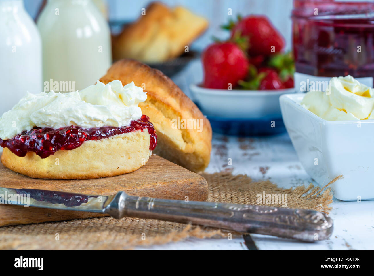 Traditional English scones with strawberry jam and clotted cream Stock ...