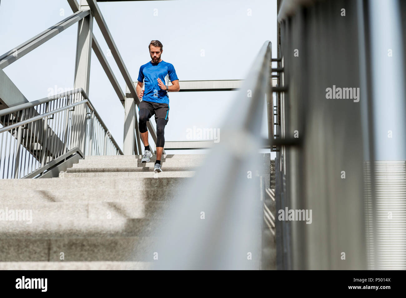 Man running down stairs Stock Photo - Alamy