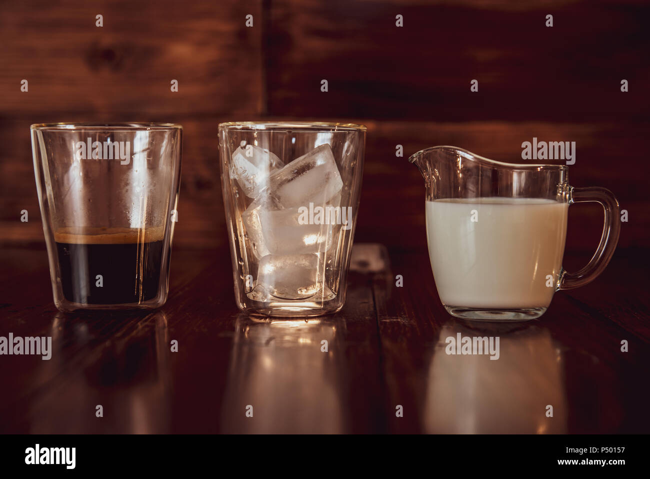 three ingredients for coffee with ice are spread out over cups Stock ...