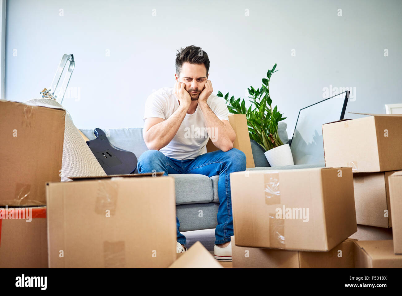 Sitting man sitting on boxes hi-res stock photography and images - Alamy