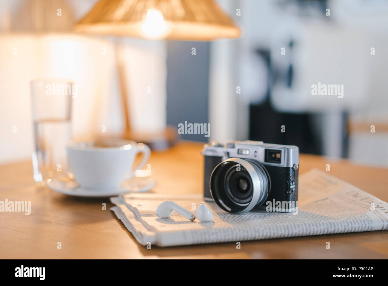 Newspaper camera table cafe hi-res stock photography and images - Alamy
