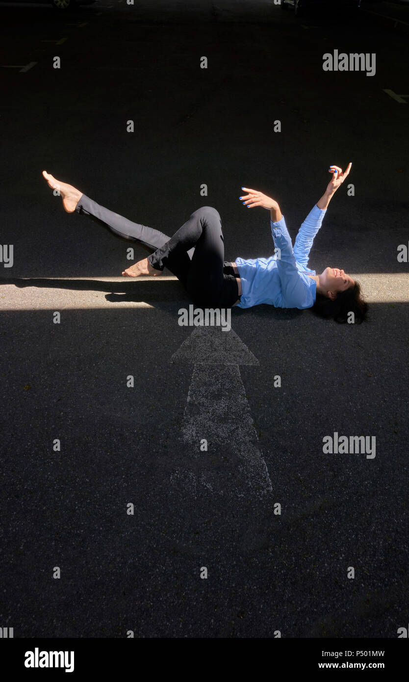 Woman lying on back legs hi-res stock photography and images - Alamy