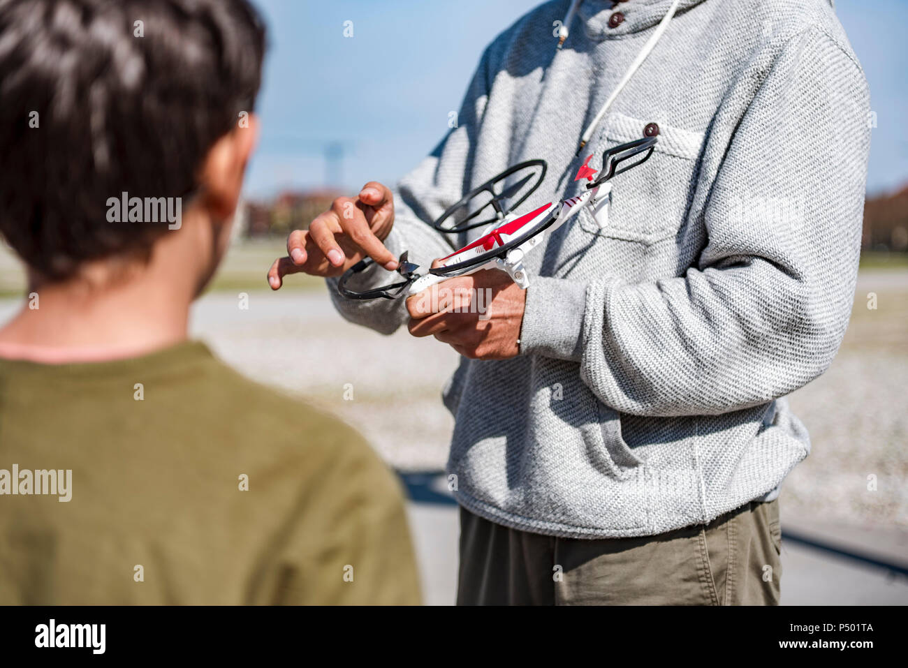 Father and son flying drone Stock Photo - Alamy