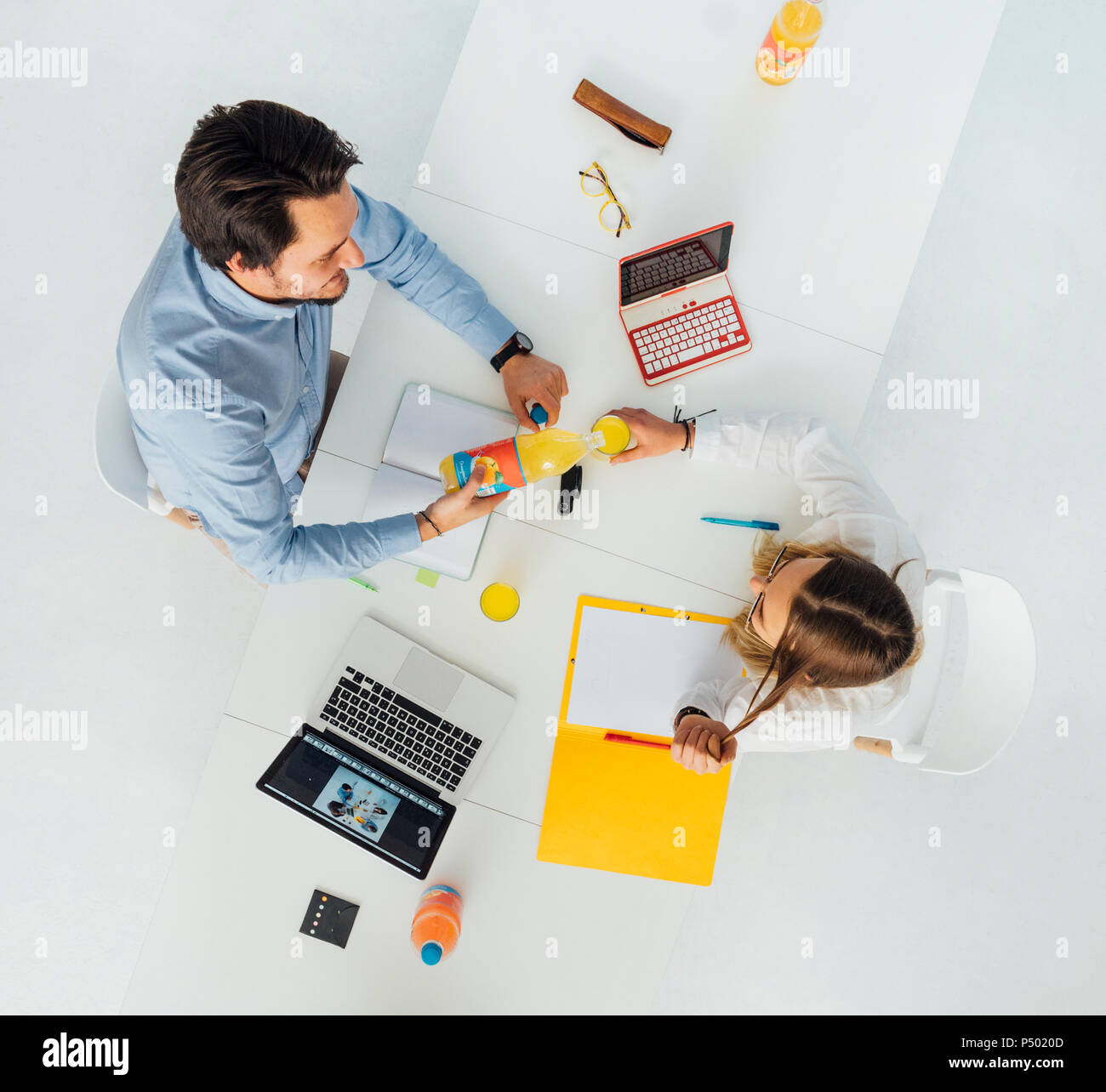 Two people working together birds eye hi-res stock photography and ...
