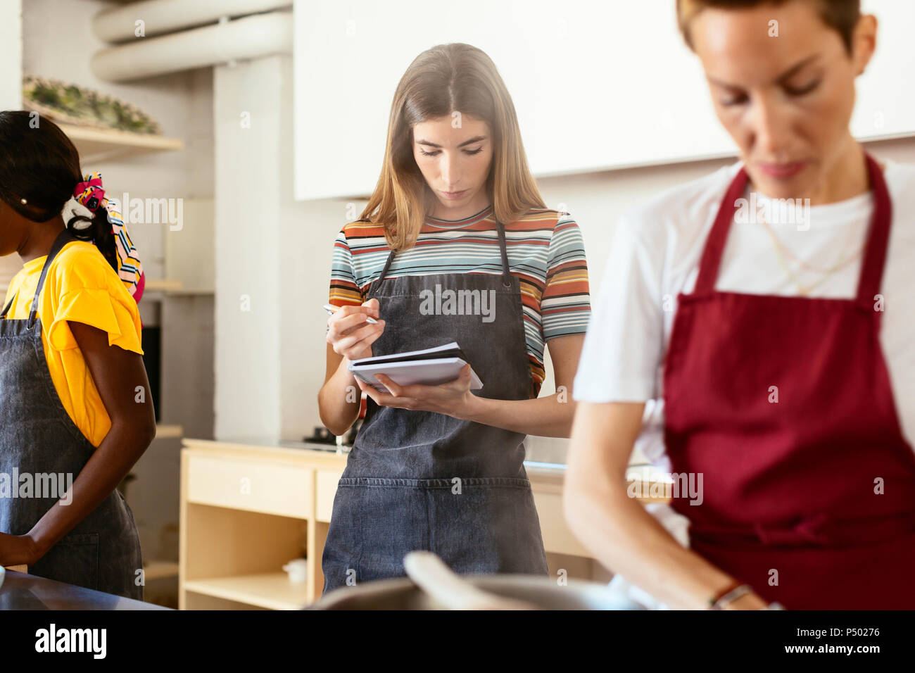 Woman taking notes hi-res stock photography and images - Alamy