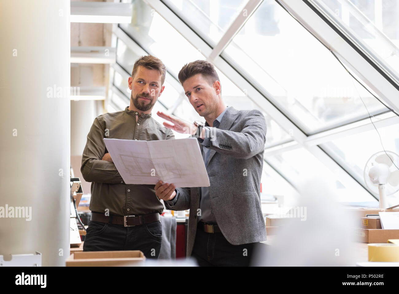 Shot two businesspeople discussing hi-res stock photography and images ...