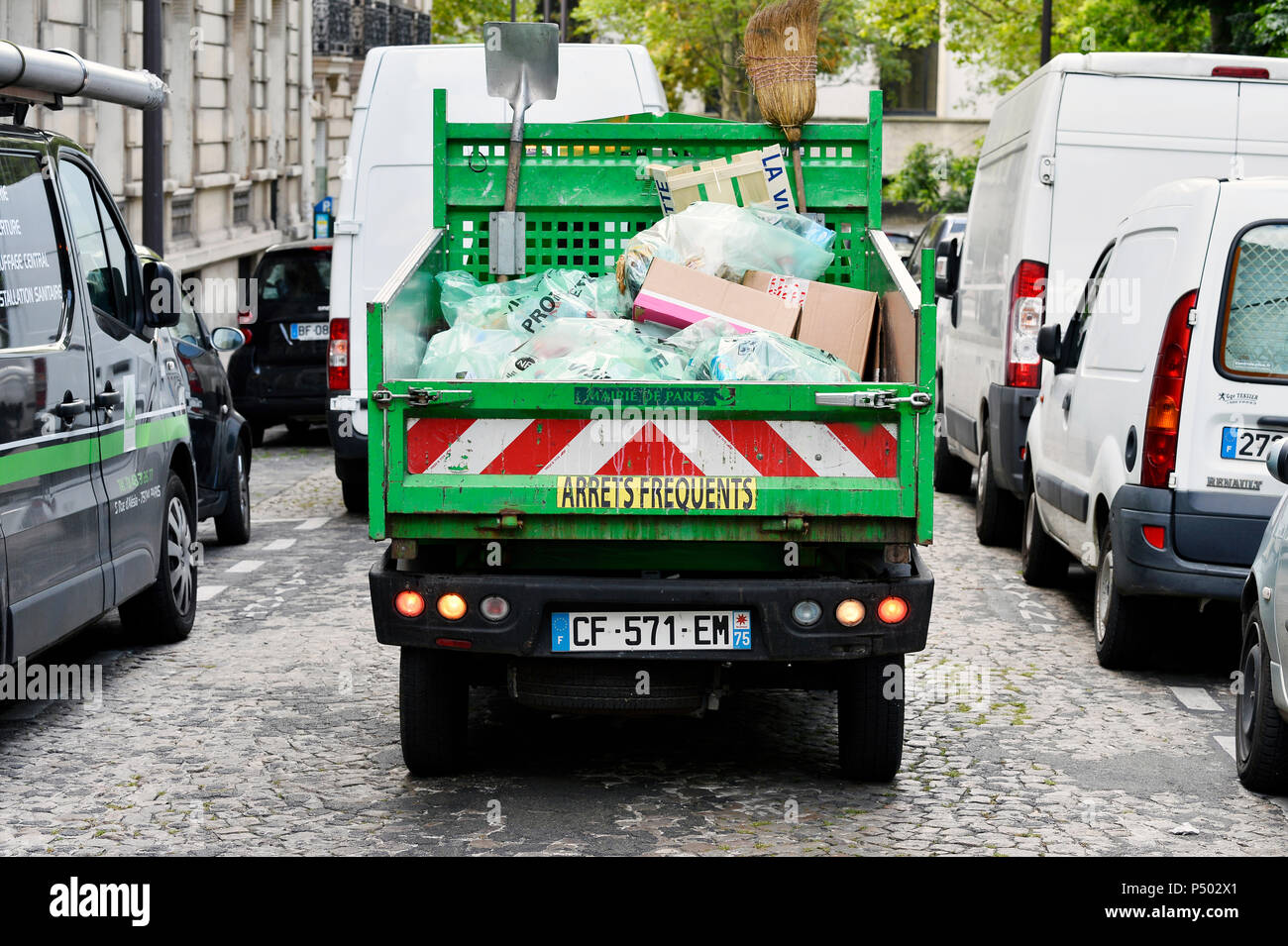 Waste disposal service vehicule - Paris- France Stock Photo - Alamy