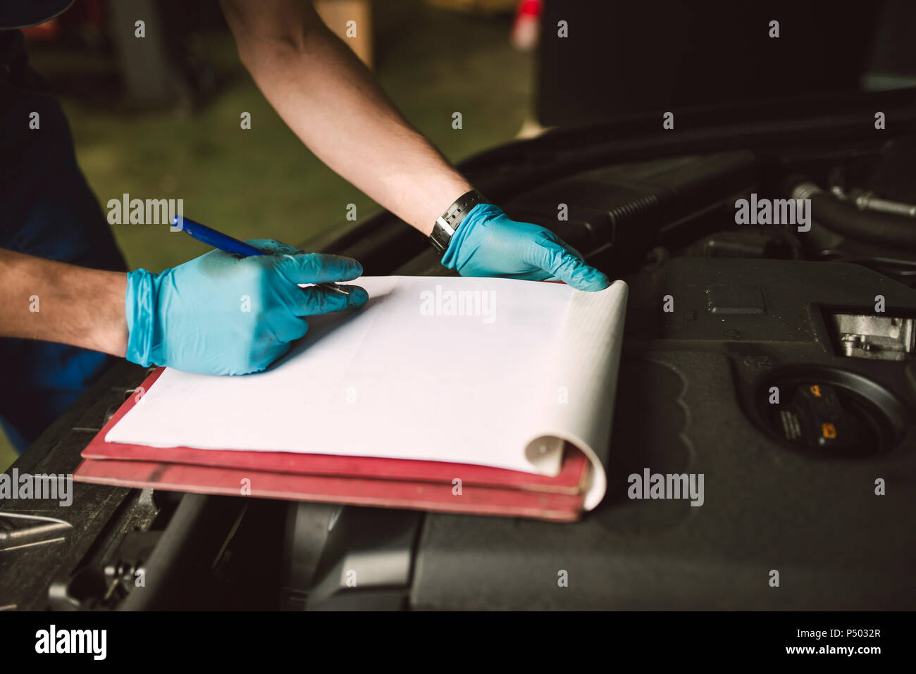 Mechanic taking notes on hi-res stock photography and images - Alamy