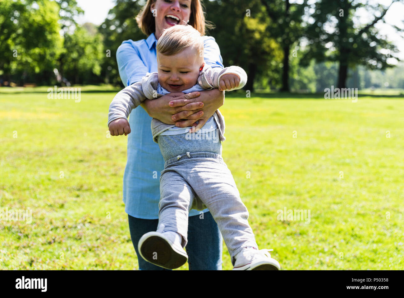 Mother lifting son hi-res stock photography and images - Alamy