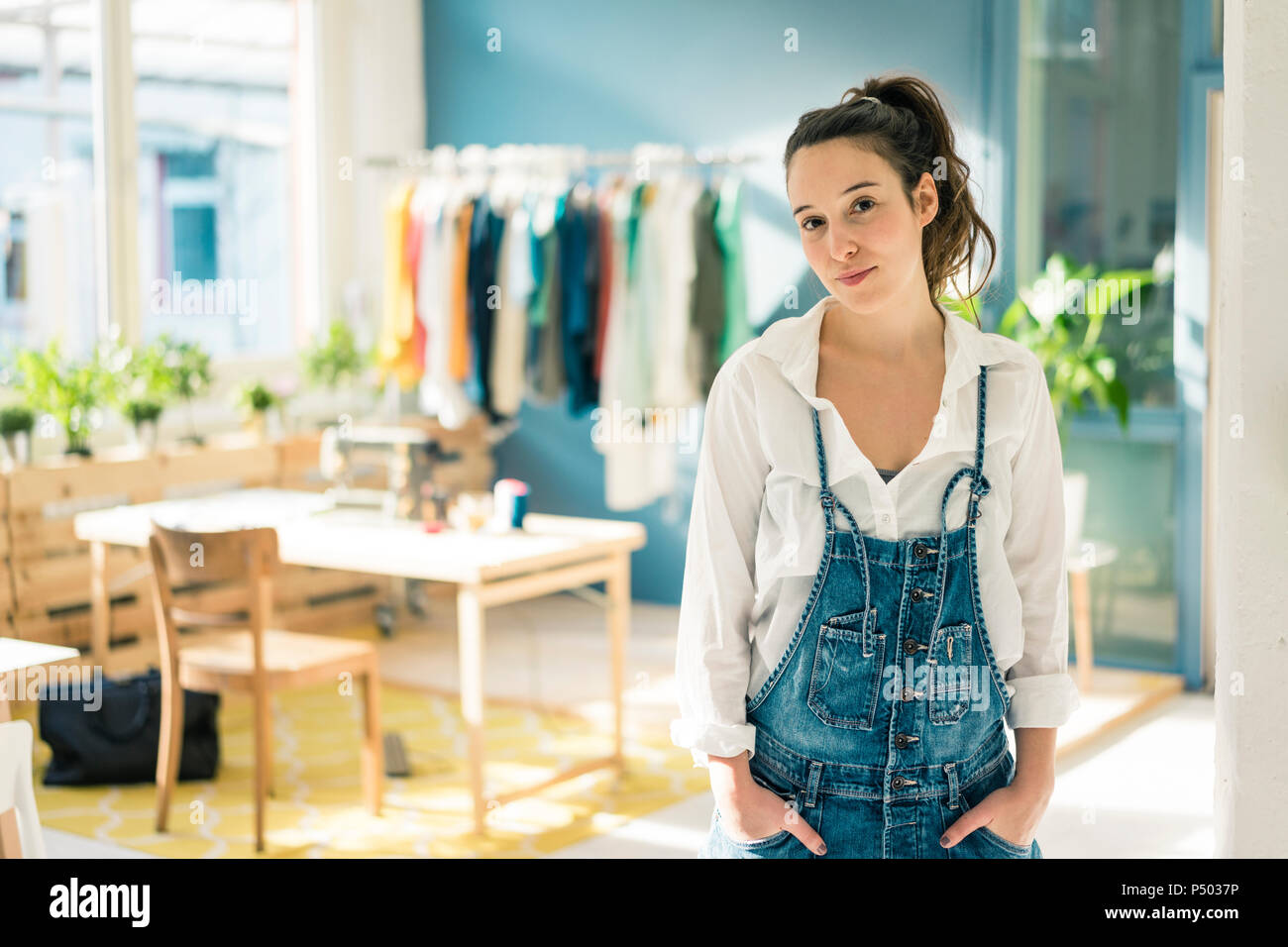 Portrait of fashion designer in her studio Stock Photo - Alamy