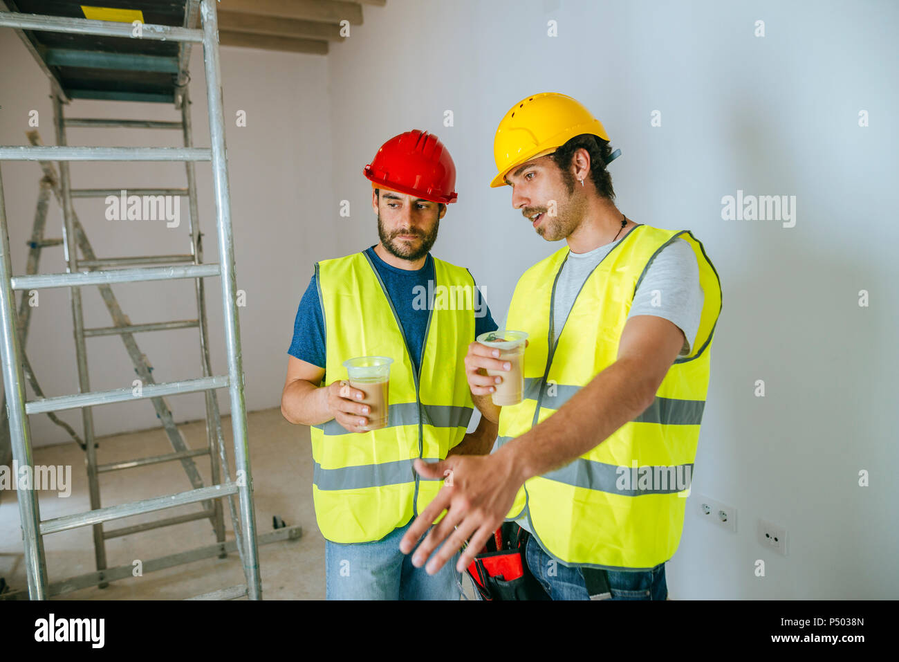 Two workers talking hi-res stock photography and images - Alamy