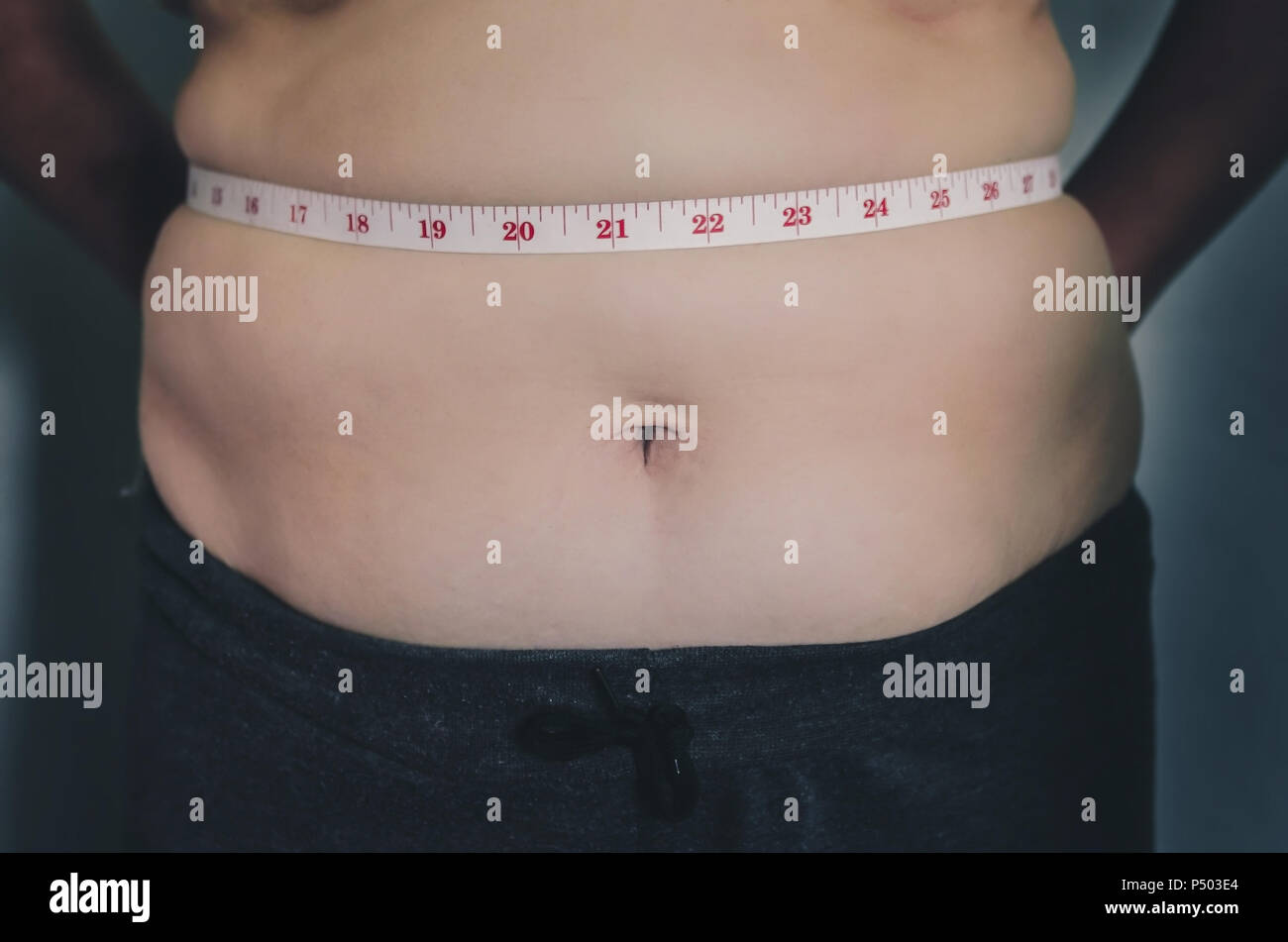 Close-up of human body and fat body, Fat body part of paunch or belly ...