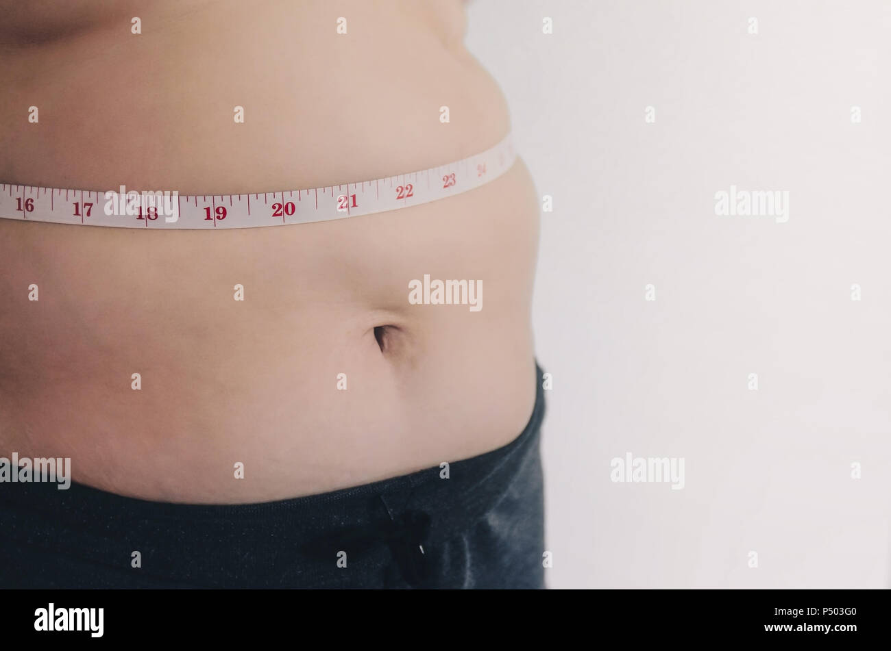 Close-up of human body and fat body, Fat body part of paunch or belly ...