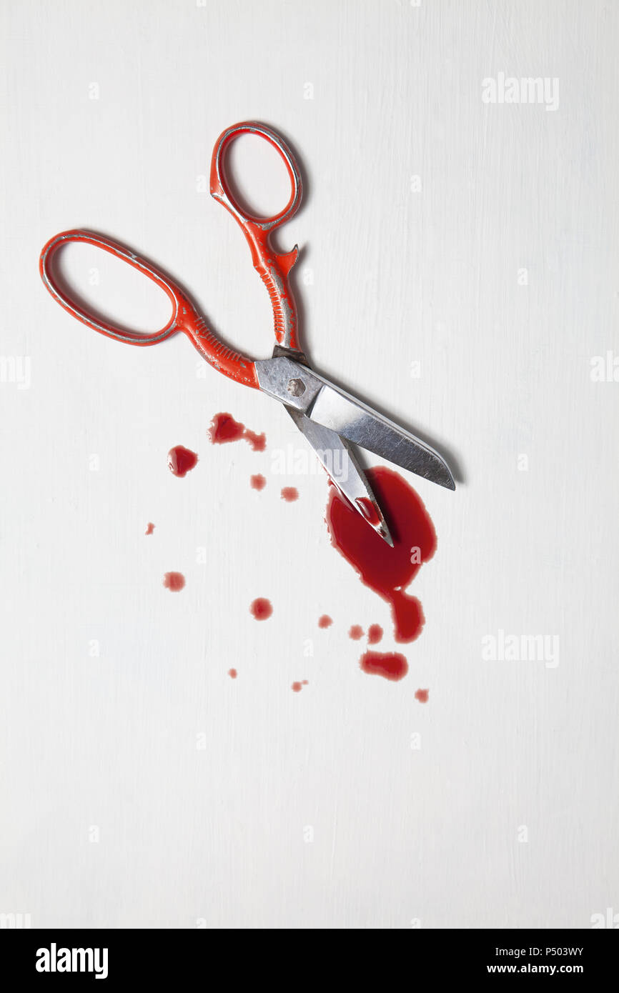 Scissors in Blood Stock Photo - Alamy