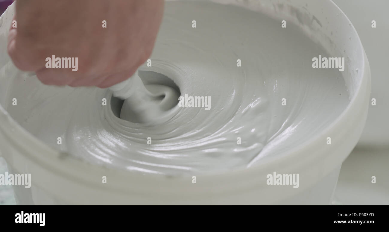 closeup mixing gray decorative concrete plaster, wide photo Stock Photo ...