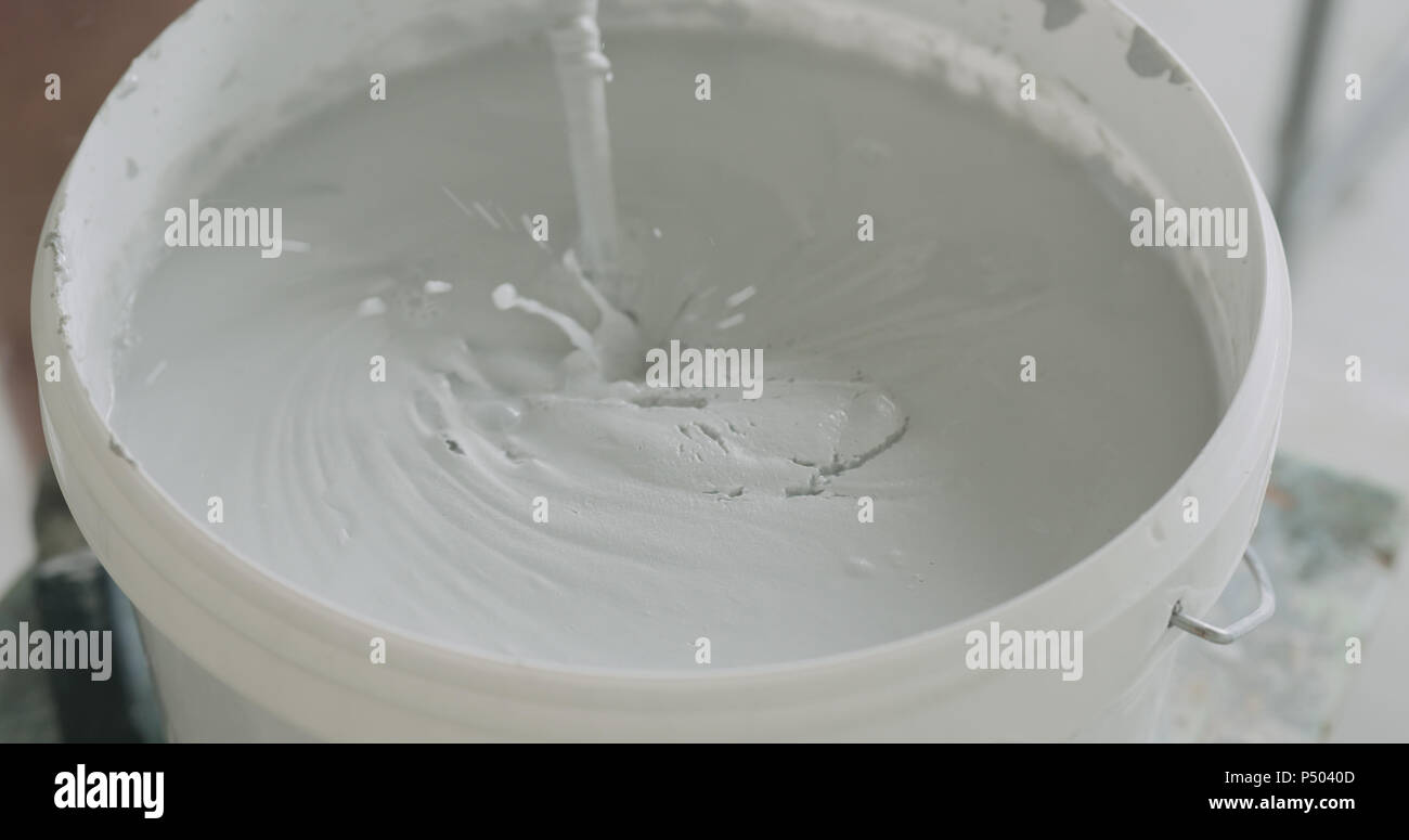 closeup mixing gray decorative concrete plaster, wide photo Stock Photo ...