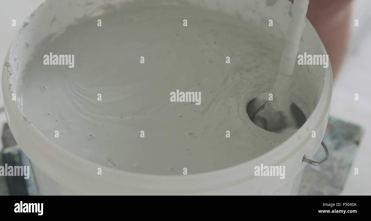 closeup mixing gray decorative concrete plaster, wide photo Stock Photo ...