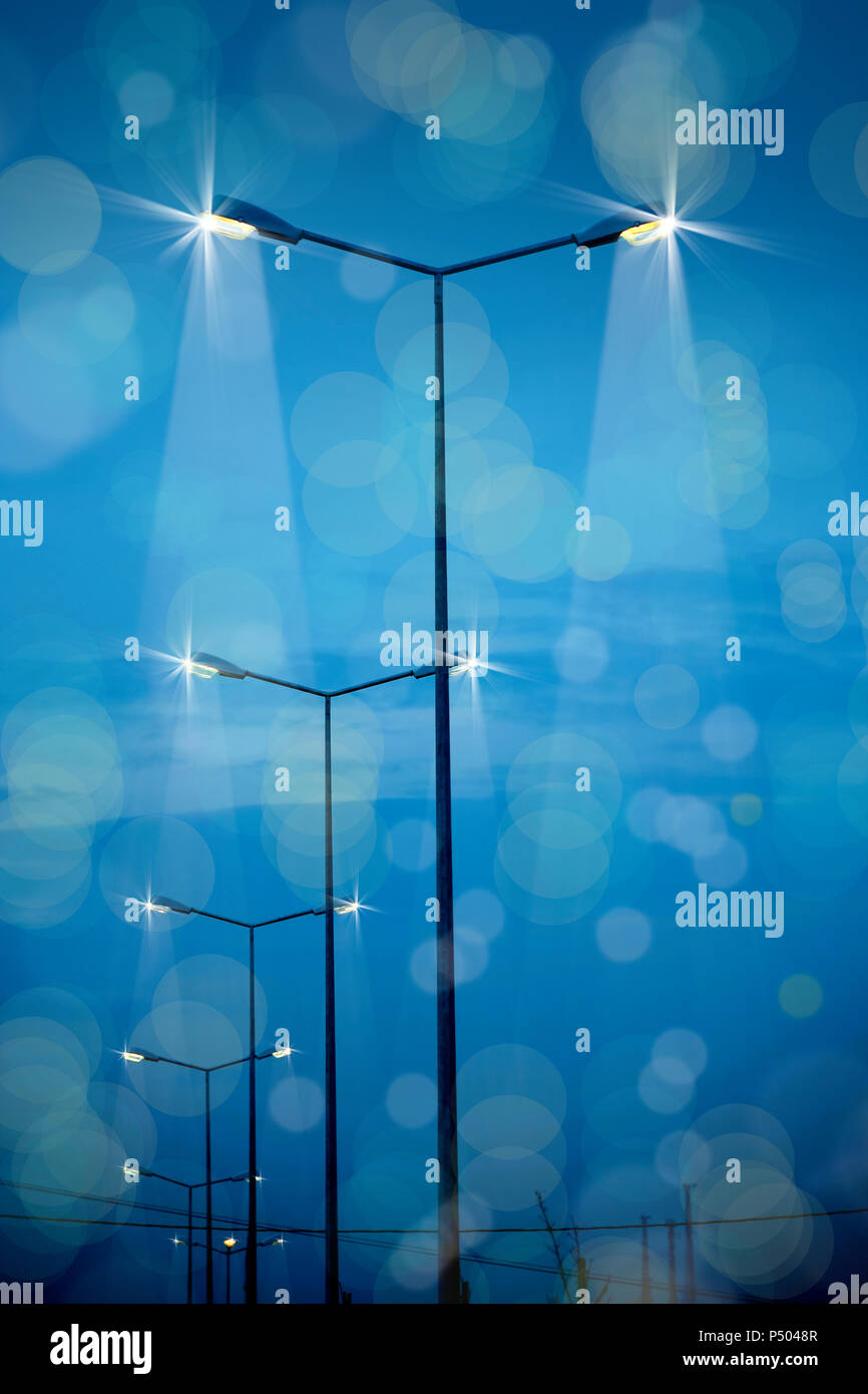 street lights at night over blue sky Stock Photo - Alamy