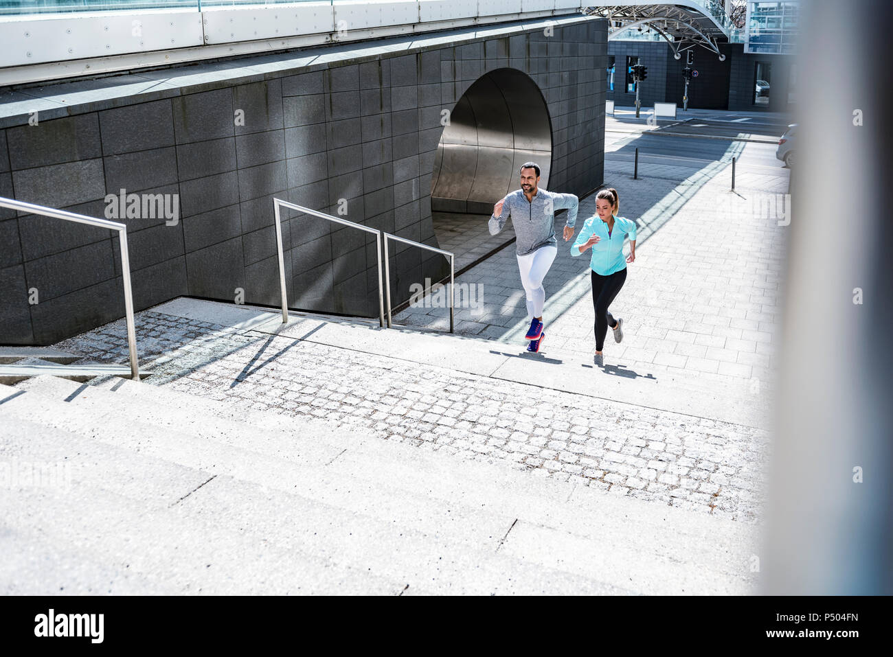 Running on stairs hi-res stock photography and images - Alamy